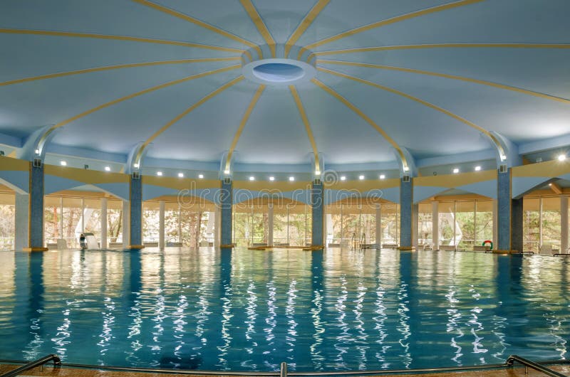 A Large Swimming Pool in a Room with Large Windows Stock Photo - Image ...