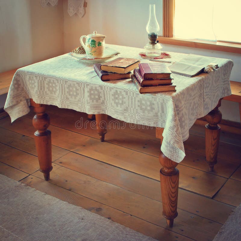 Large Table with Books and a Lamp Stock Photo - Image of books, desk ...