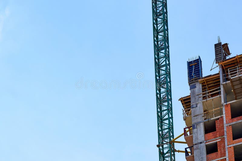 Large Construction High Rise Crane and Clear Blue Sky Stock Photo ...