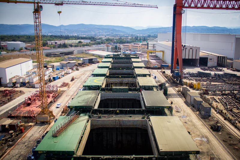A Large Tanker Cargo Ship is Being Renovated and Painted in Shipyard ...