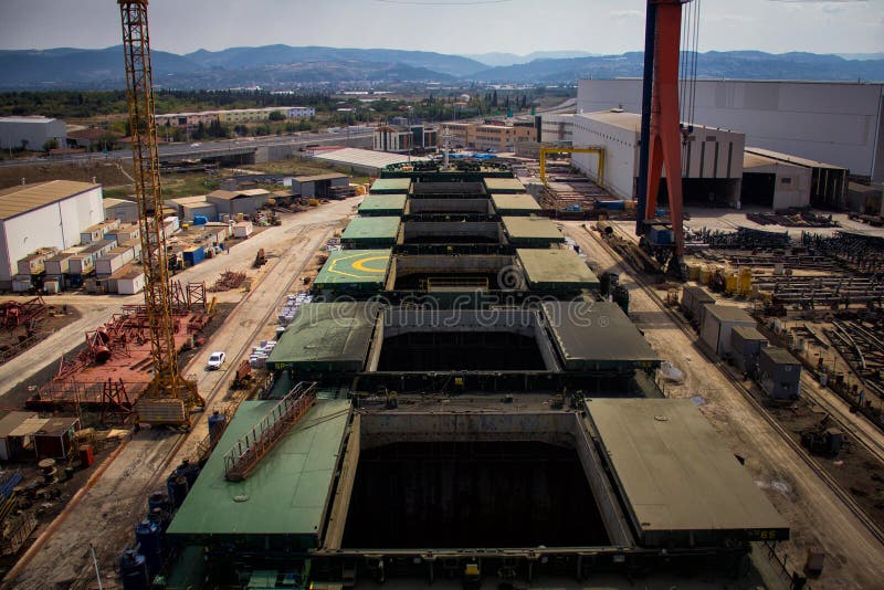 A Large Tanker Cargo Ship is Being Renovated and Painted in Shipyard ...