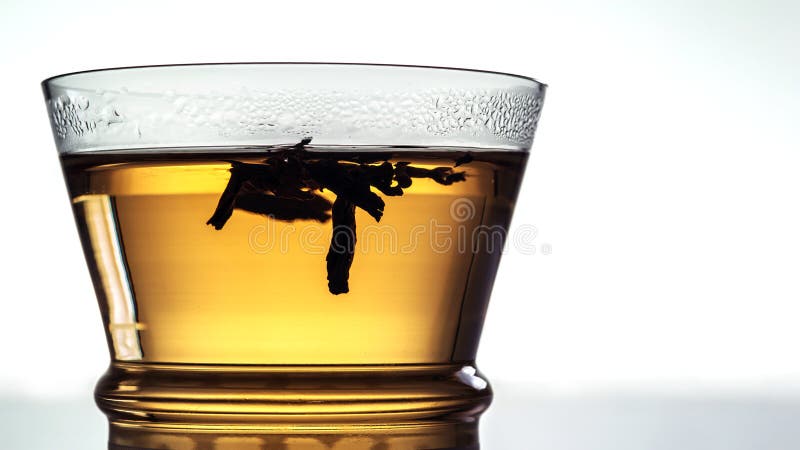 Large Tea Leaves are Brewed in a Glass Beaker on White Stock Image ...