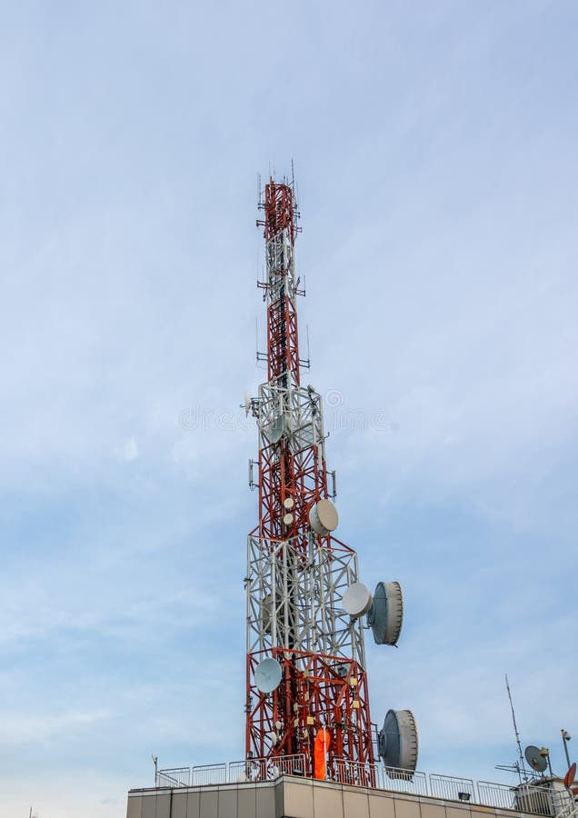 Large Telecommunication Tower Against Sky and Clouds in Background ...