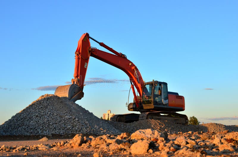 Large Tracked Excavator Works in a Gravel Pit. Salvaging and Recycling ...