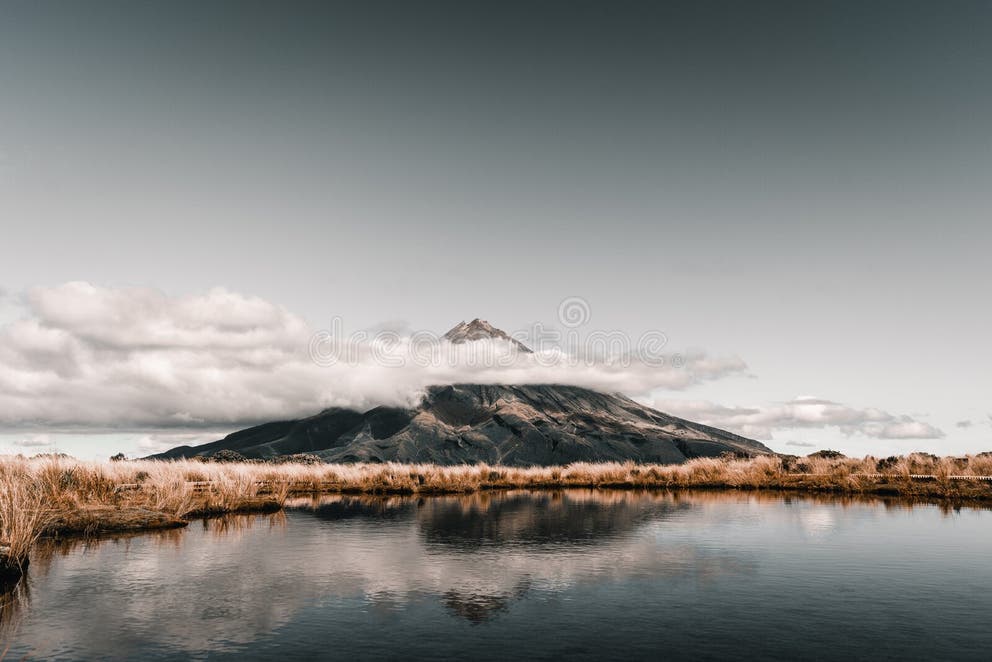 Large Triangular Shaped Mountain with a Large Summit Reflected in the ...