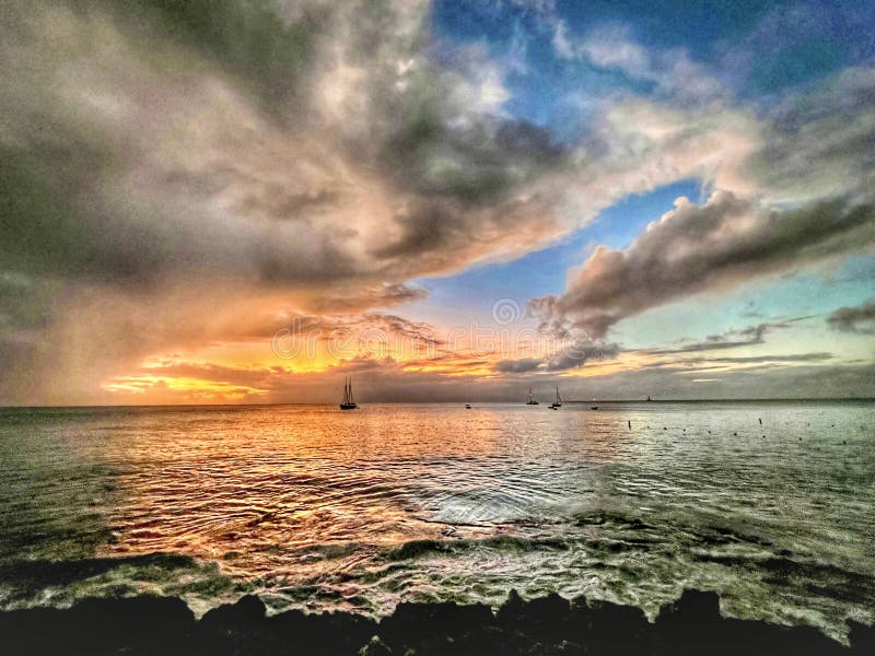 Large Tropical Sunset stock photo. Image of sailing - 265211920