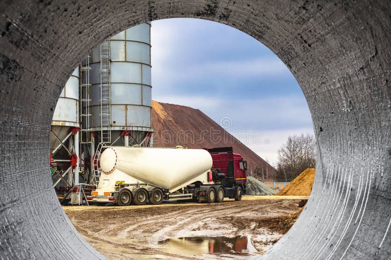 Large Truck for Transporting Cement. a Cement Truck Unloads Cement at a ...