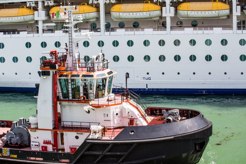 Large Tugboat by Cruise Ship Stock Image - Image of vacation, europe ...