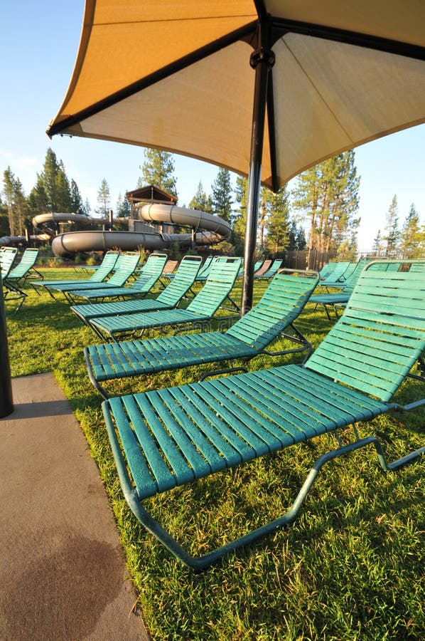 Large Umbrella Around Pool with Lounge Chairs Stock Image - Image of ...