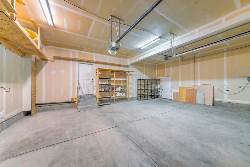 Large Unfinished Garage Interior with Wall Patch Marks Stock Photo ...