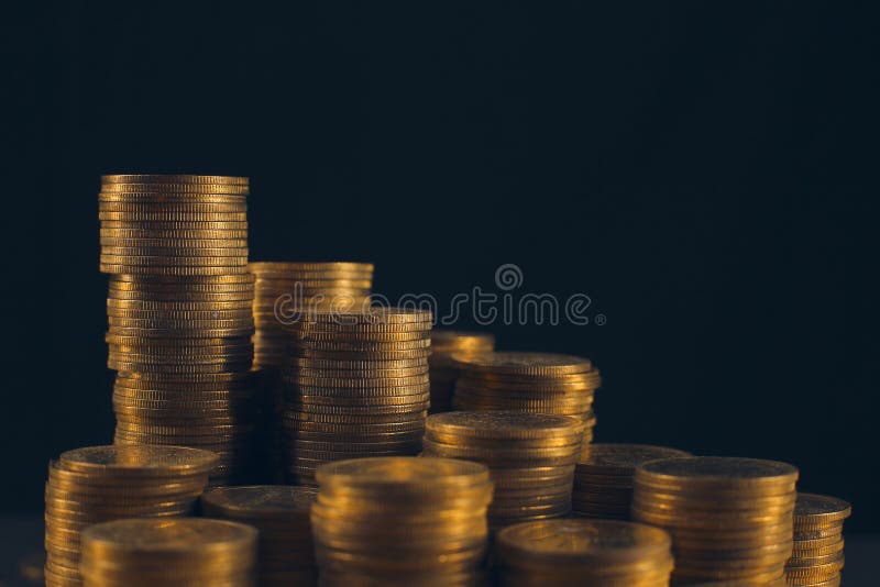 A Large Variety of Coins on a Black Background. Stack of Coins Stock ...