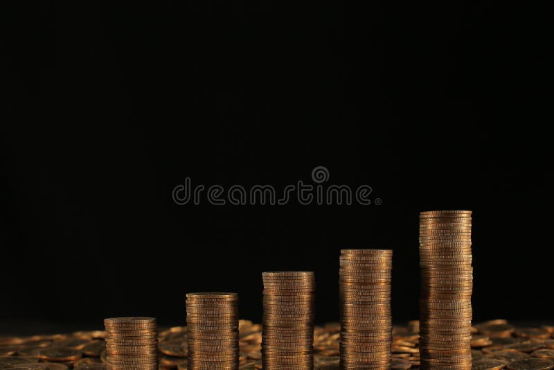 A Large Variety of Coins Isolated on a Black Background. Stack of Coins ...