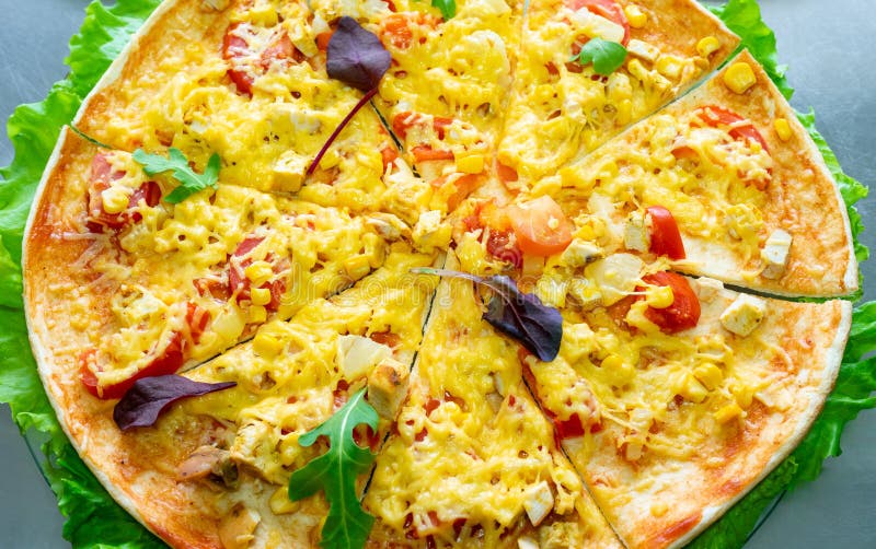 Freshly Baked Vegetable Pizza Topped with Cheese and Greens Stock Photo ...