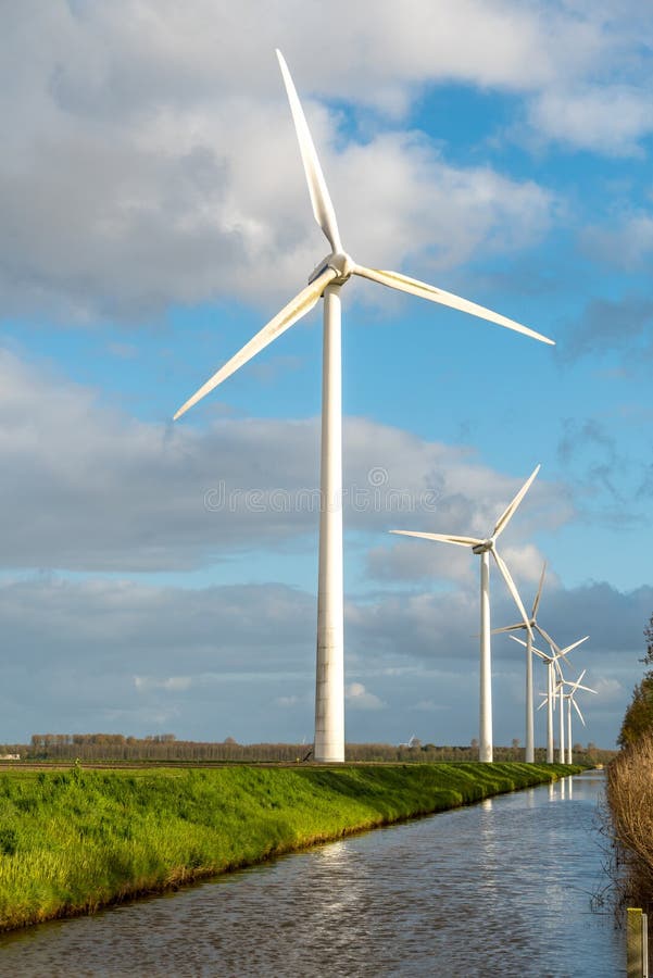 Windmills on the field stock photo. Image of conservation - 106824862
