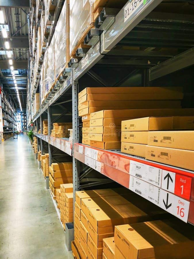 Large Warehouse with Long Racks Filled with Packaged Goods Stock Image ...
