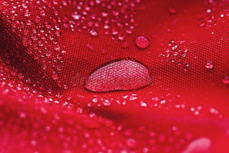 Large Water Drop on Red Waterproof Fabric Stock Photo - Image of ...
