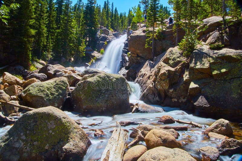 Large Waterfall into Boulders Surrounded by Pine Trees Stock Image ...