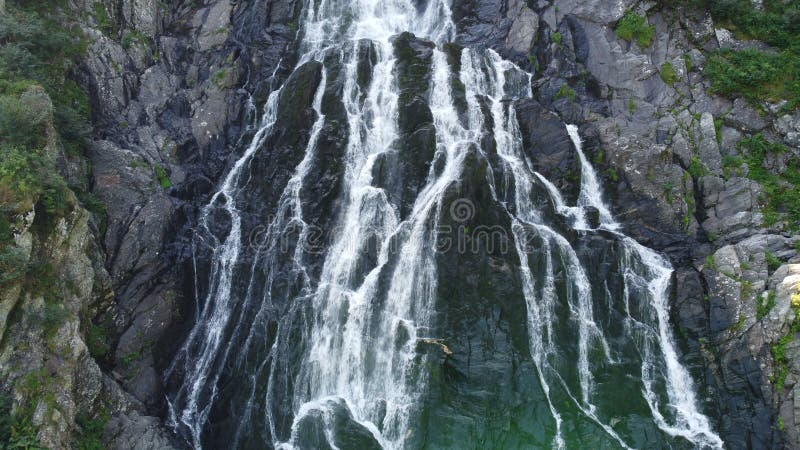 The Large Waterfall Flowing from the Mountain. Waterfall with a Very ...