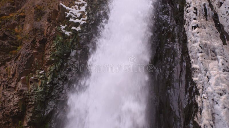 The Waterfall Flows Down the Cliff. Looking through the Water. View ...