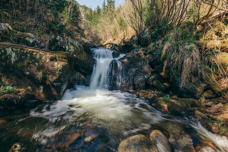 Waterfall Over Stones Into Pond Stock Photo - Image of cascade, speed ...