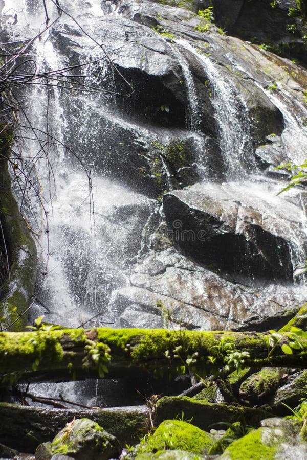 A Large Waterfall with Water Flowing Down the Rocks Stock Image - Image ...