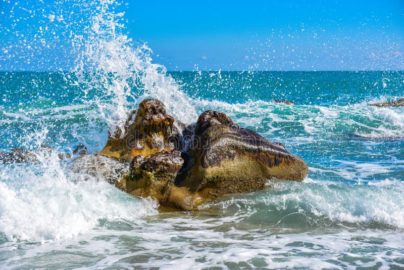 Large Wave Crash Against the Rocks at the Beach. Stock Photo - Image of ...