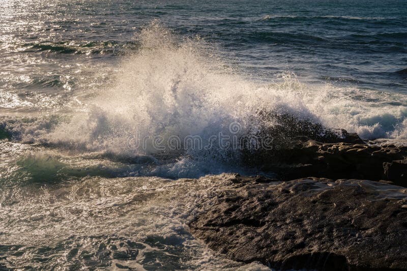 Large Wave Crashes into a Rocky Shoreline Stock Image - Image of scenic ...