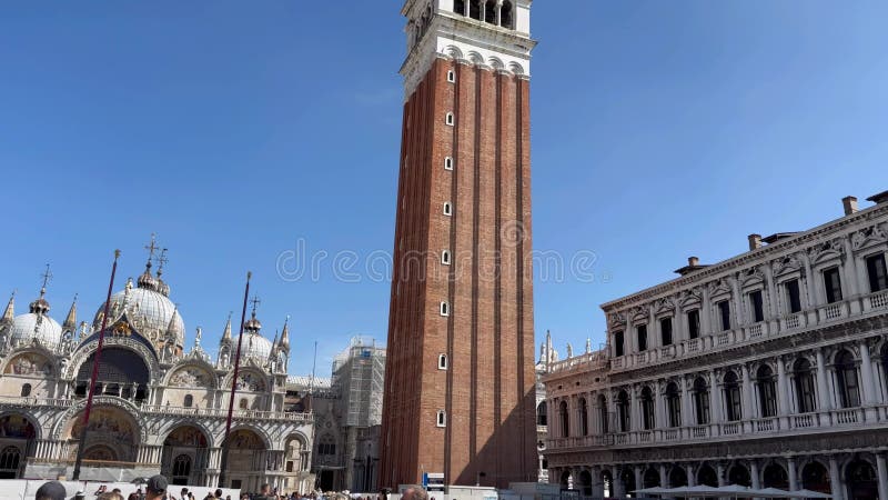 A Large White Building with a Clock Tower and a Bell. the Building is ...