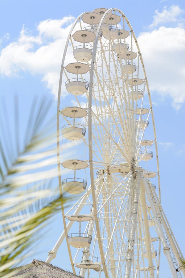 Large White Observation Wheel Against Blue Cloudy Sky Stock Image ...
