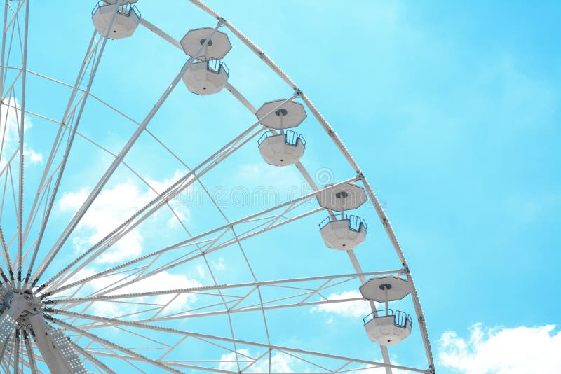Large White Observation Wheel Against Blue Cloudy Sky, Low Angle View ...