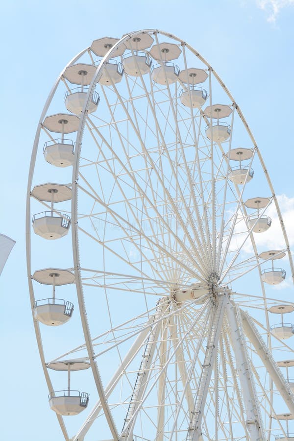 Large White Observation Wheel Against Blue Cloudy Sky, Low Angle View ...