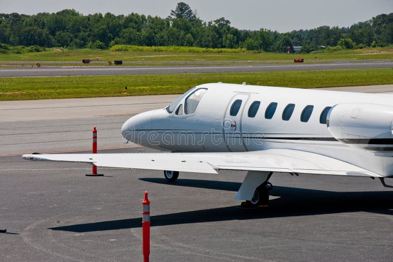 Large White Private Jet on Tarmac Stock Image - Image of plane, runway ...