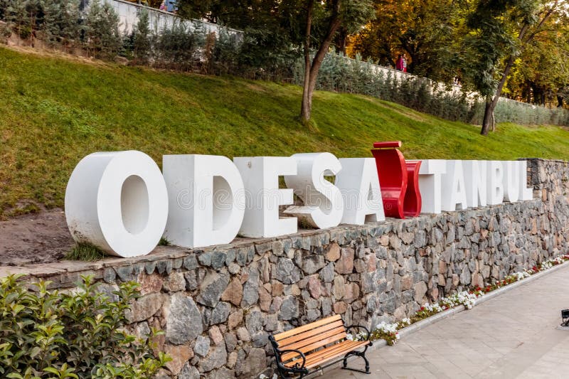 A Large White Sign with Red Letters that Say ODESA TANBUL Stock Photo ...