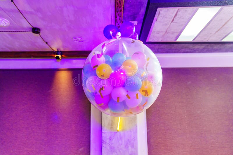 A Large White Transparent Balloon with Small Multi-colored Balloons ...