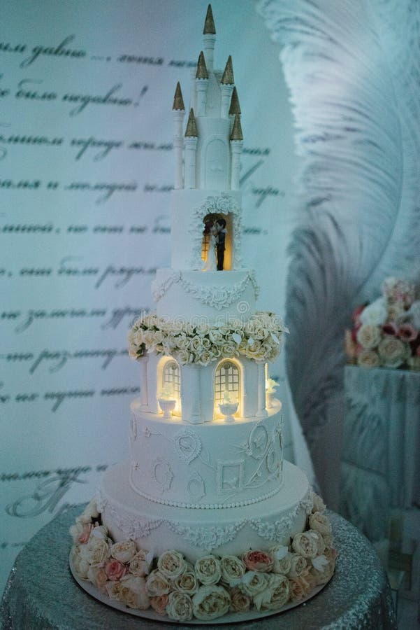 Large White Wedding Cake with Castle Shaped Towers Stock Photo - Image ...