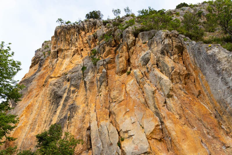 Large Wild Red Limestone Cliffs with Sparse Vegetation Stock Image ...