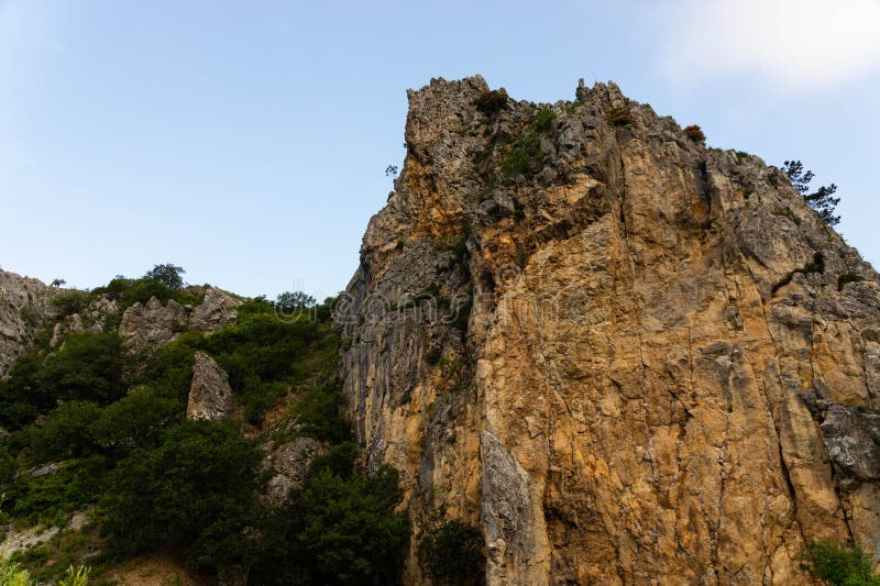 Large Wild Red Limestone Cliffs with Sparse Vegetation Stock Image ...