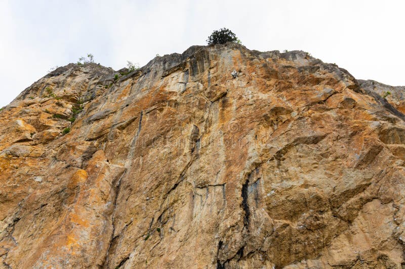 Large Wild Red Limestone Cliffs with Sparse Vegetation Stock Photo ...