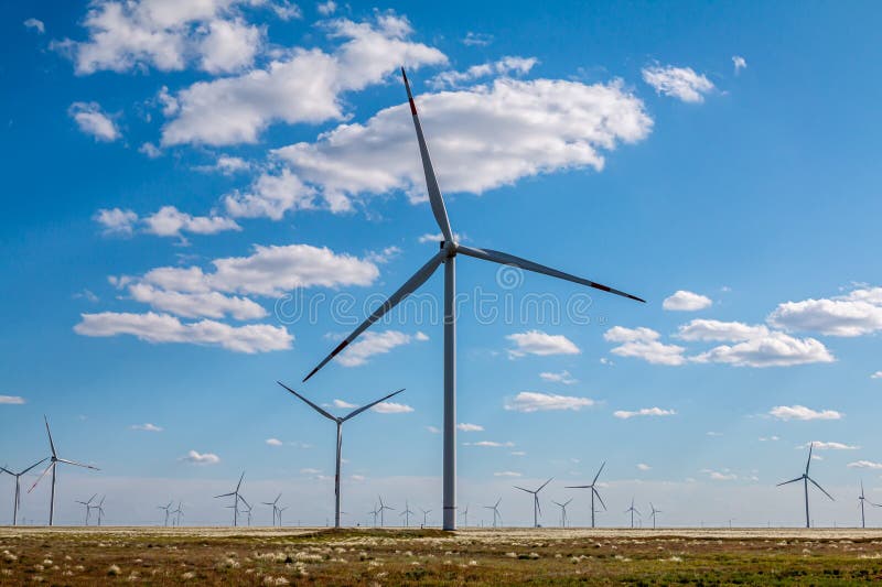 Large Wind Farm in a Field on a Clear Sunny Day Stock Photo - Image of ...