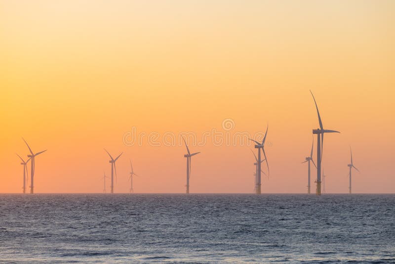 Large Wind Turbines Producing Plant on Sea Under Sunset Stock Photo ...