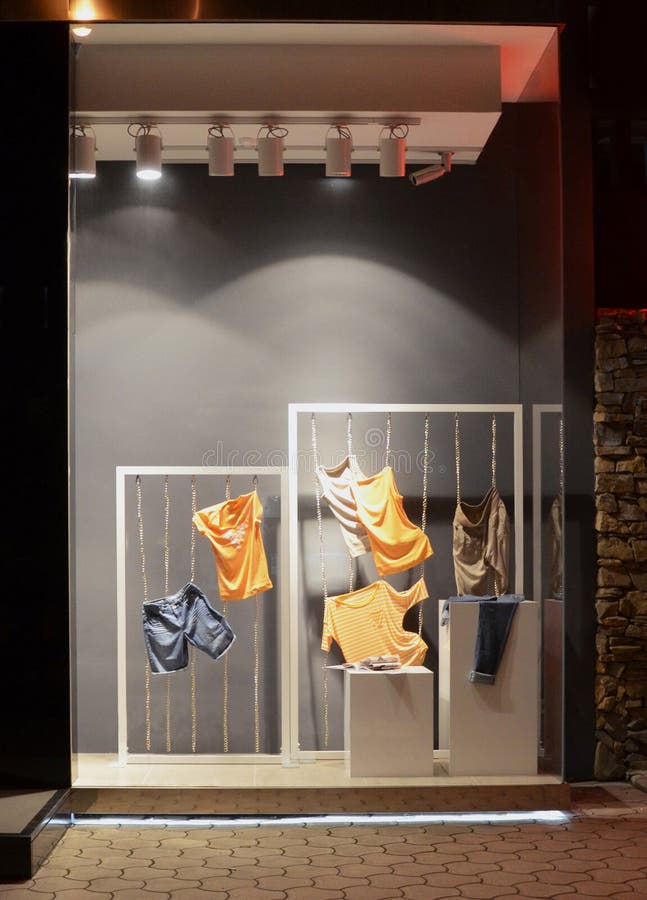 Large Window Showcase with T-shirts and Denim Shorts Stock Photo ...