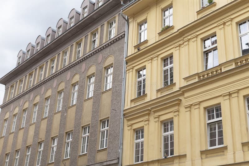 A Large Windowed Building is Next To a Smaller Building Stock Photo ...