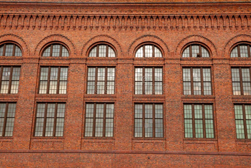 Large Windows on the Side of a Red Bricked Building Stock Photo - Image ...