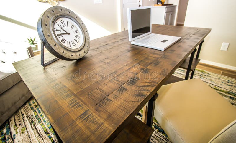 Large Wooden Desk with Clock and Laptop Stock Photo - Image of room ...