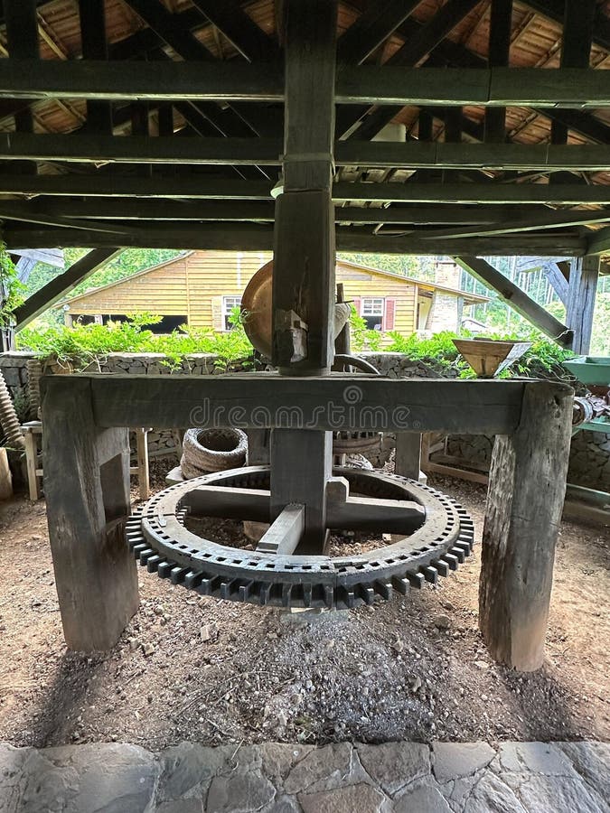 A Large, Wooden Mechanical Structure Featuring a Central Vertical Beam ...