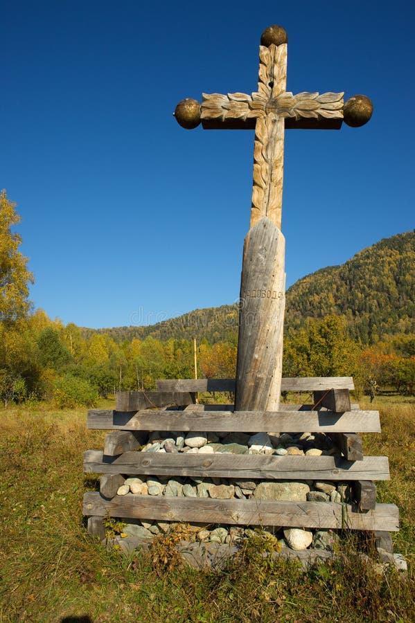 A Large Wooden Orthodox Cross Stands in an Open Field Under a Blue Sky ...