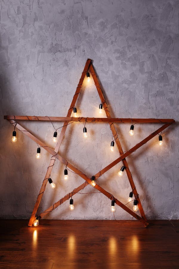 A Wooden Star with Glowing Lamps Stock Photo - Image of lamp, loft ...