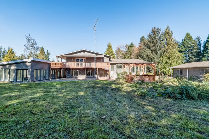Large Yard Two Story Home with Deck in Forest Stock Image - Image of ...