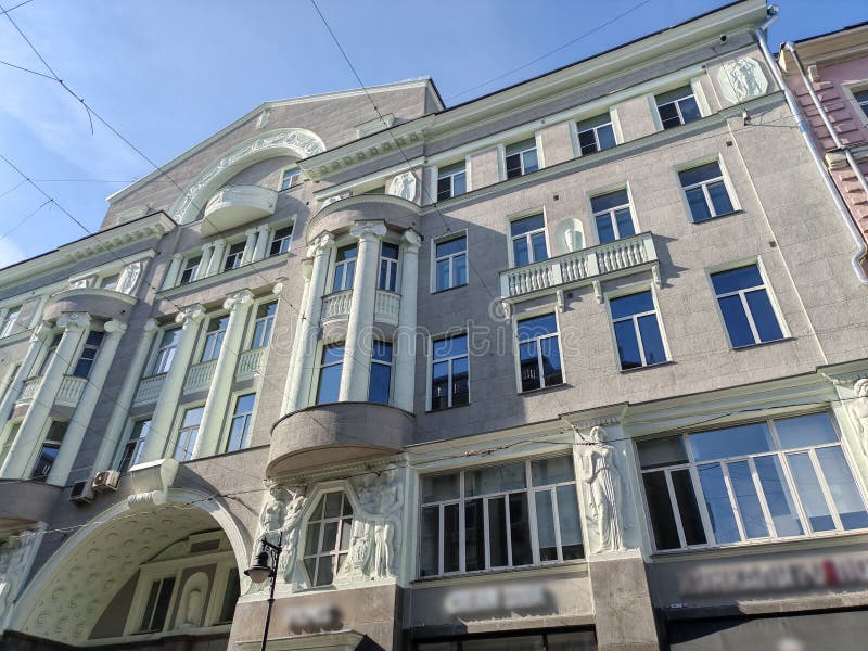 Large Yellow Building with Multiple Windows and an Arched Doorway ...