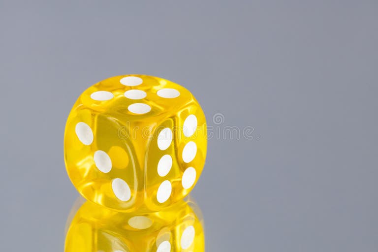 Large Yellow Dice on a Gray Background Stock Photo - Image of large ...